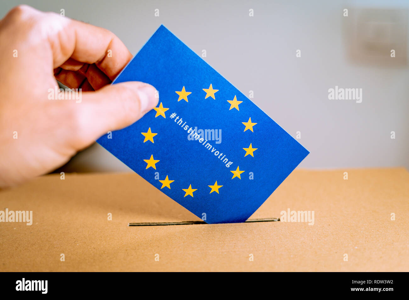 Election in European Union - voting at the ballot box. Hand putting in ...