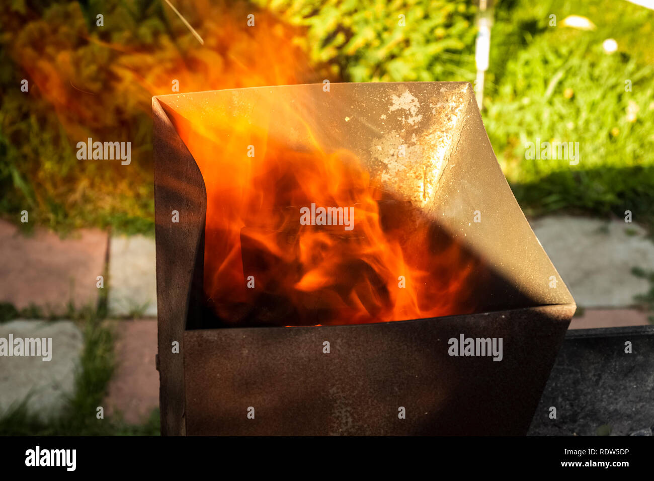 Strong fire from the brazier in preparation for cooking food outdoors ...