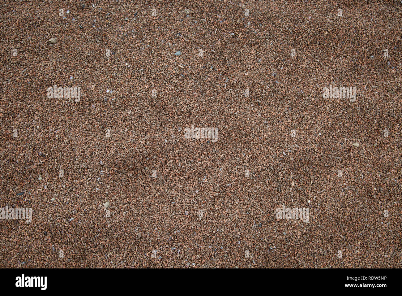 Texture red fine gravel Stock Photo - Alamy