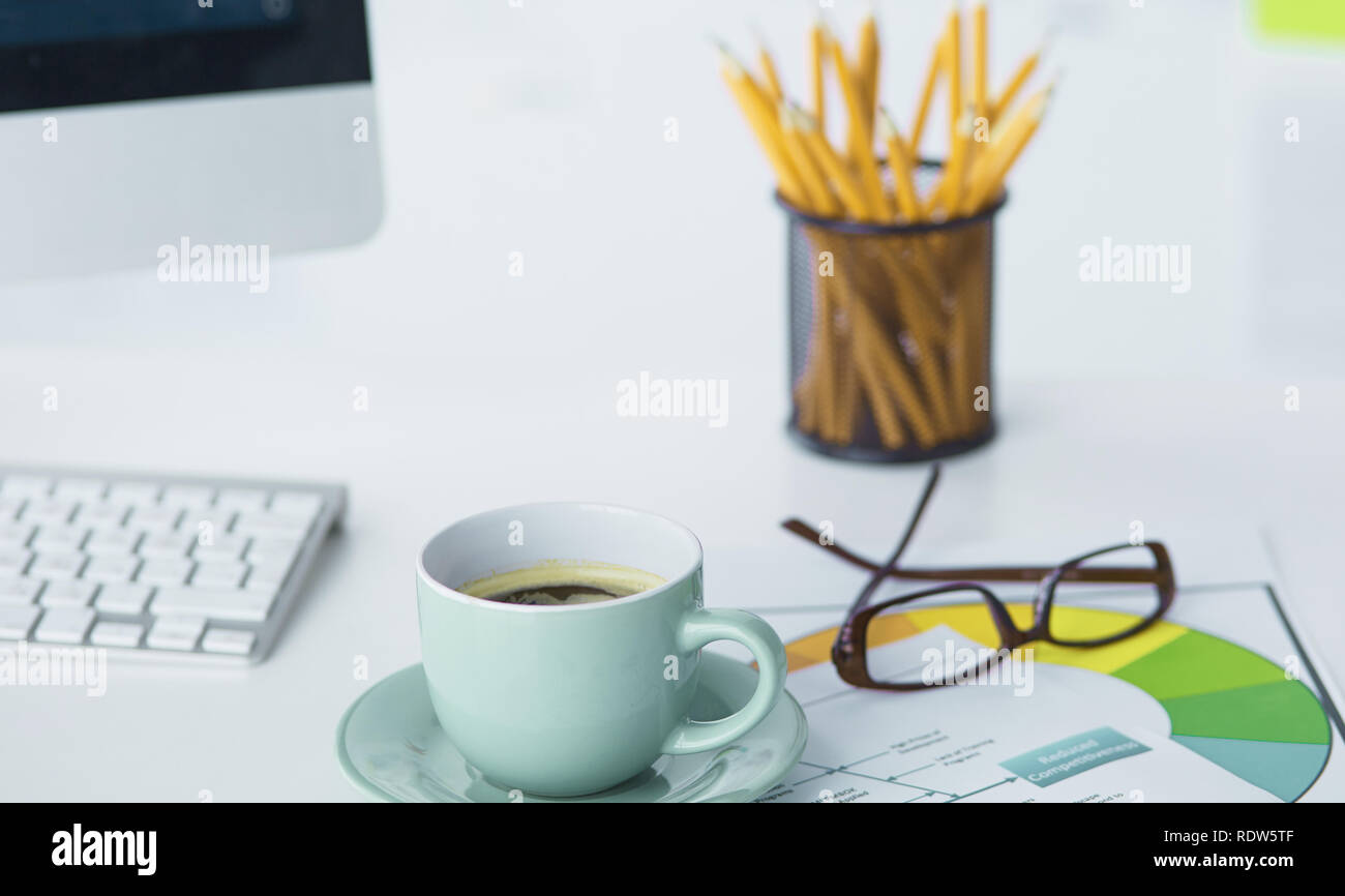 A cup of coffee on the office table Stock Photo - Alamy
