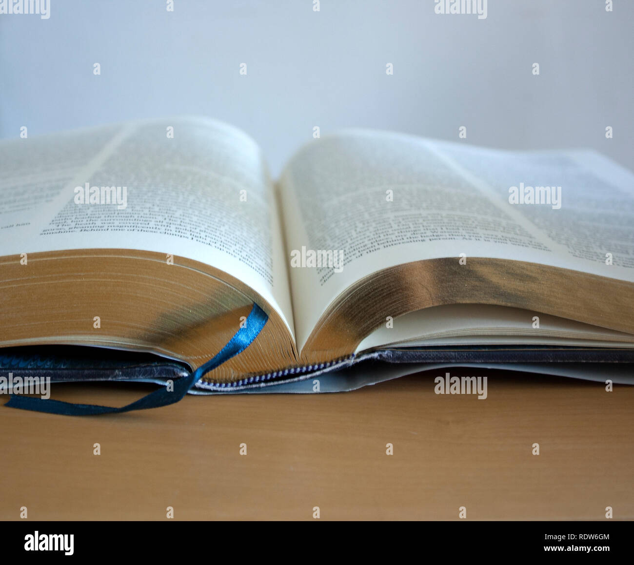 An open book on a table Stock Photo - Alamy
