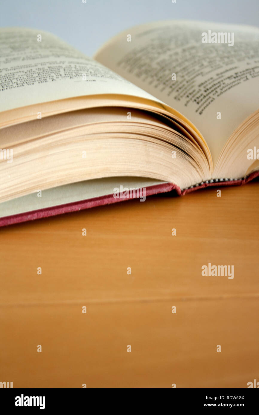 An open book on a table Stock Photo - Alamy