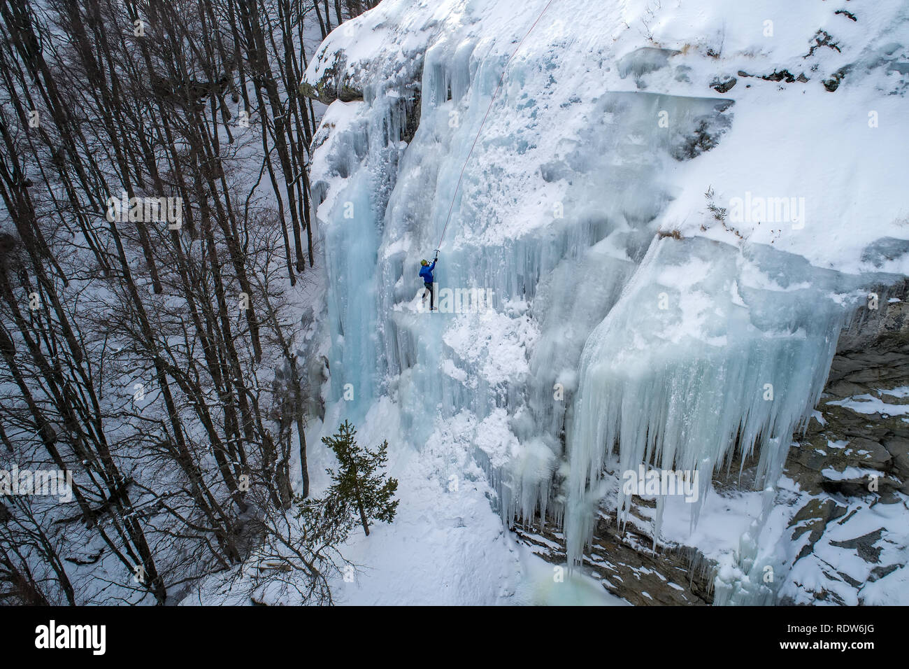 Ice climbing the North Greece, man climbing frozen waterfall Stock ...