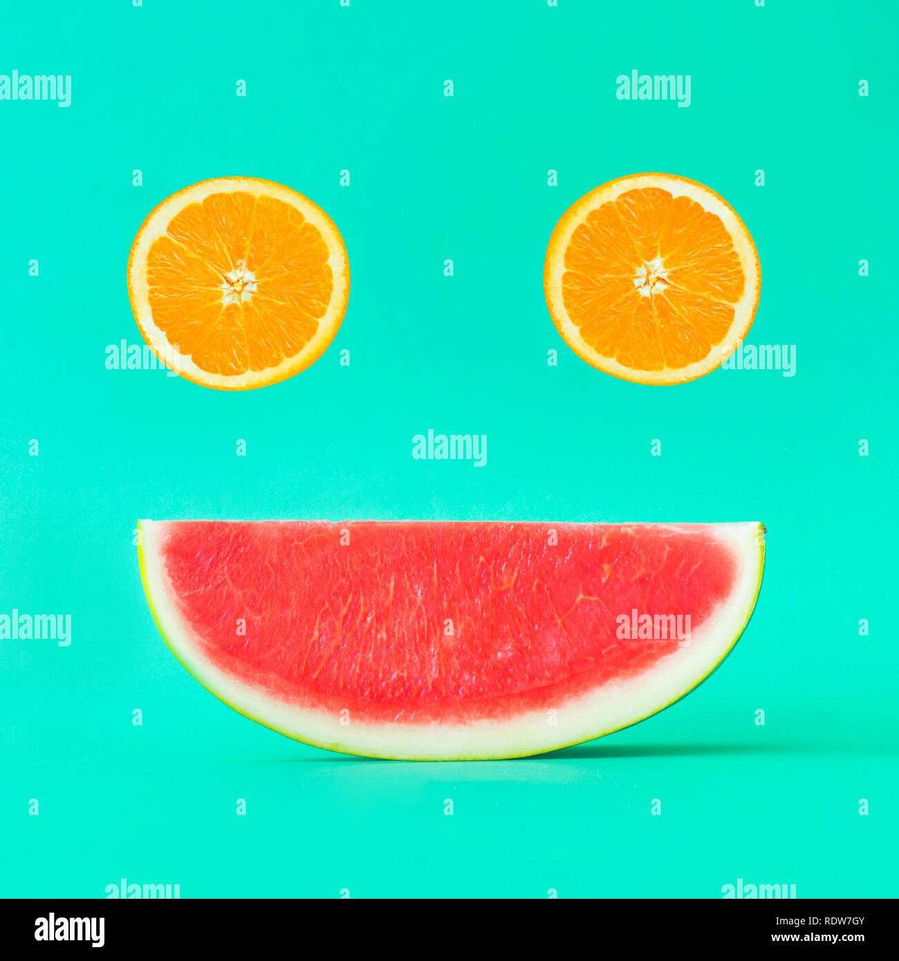 Fruits and summer concept idea with watermelon and orange human face ...