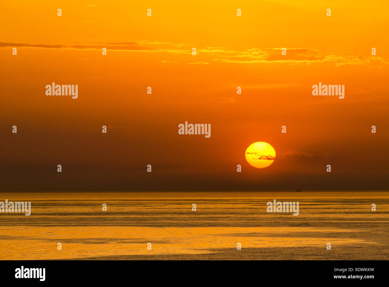 Fiery orange sunrise off the coast of Sicily in Palermo, Italy Stock ...