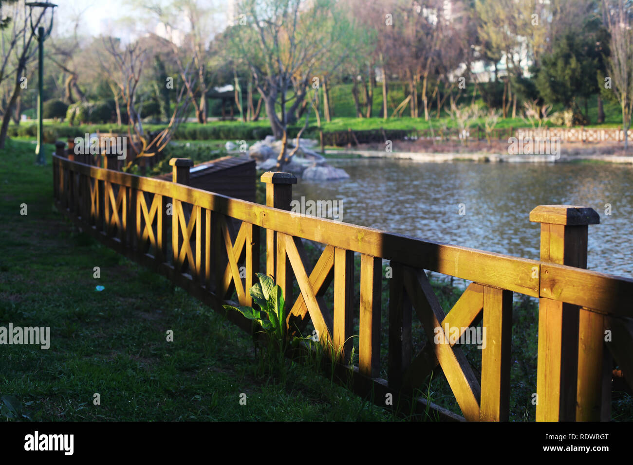 Wooden fence at lake Stock Photo - Alamy