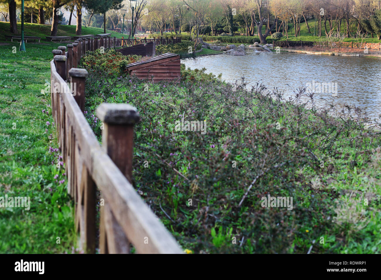 Wooden fence at lake Stock Photo - Alamy