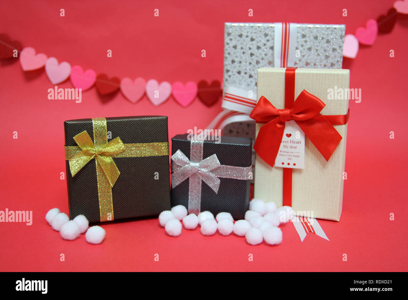 Gift box with red theme Stock Photo - Alamy