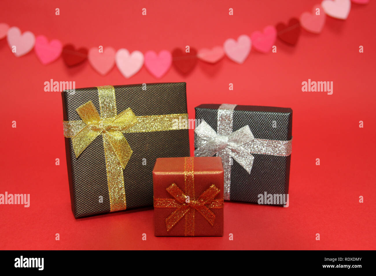 Gift box with red theme Stock Photo - Alamy