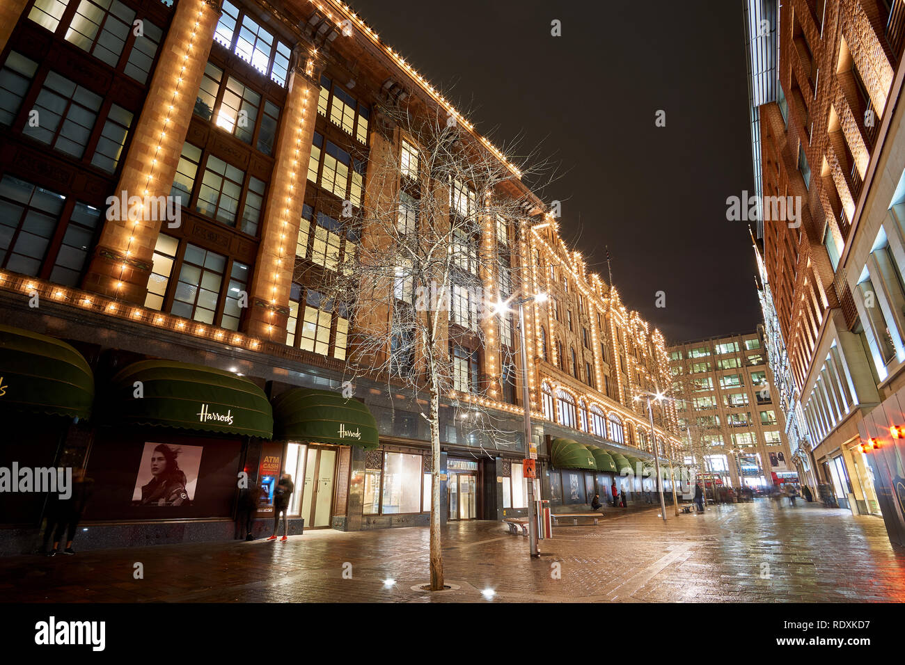 Exterior view of Harrods Department Store in London at night during ...