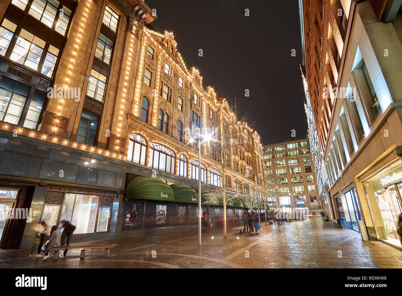 Exterior view of Harrods Department Store in London at night during ...