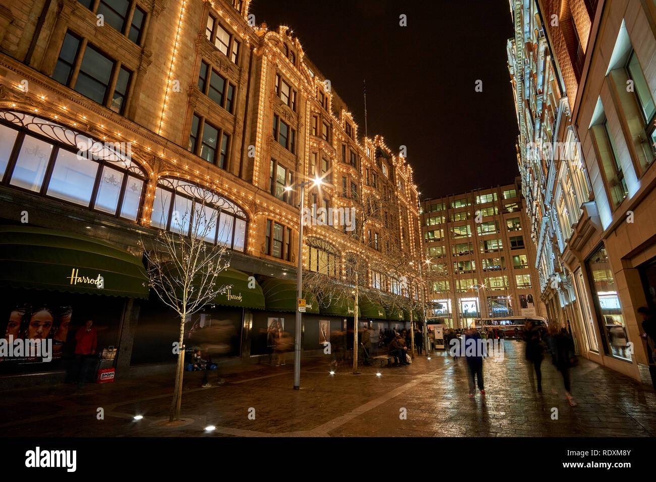 Exterior view of Harrods Department Store in London at night during ...