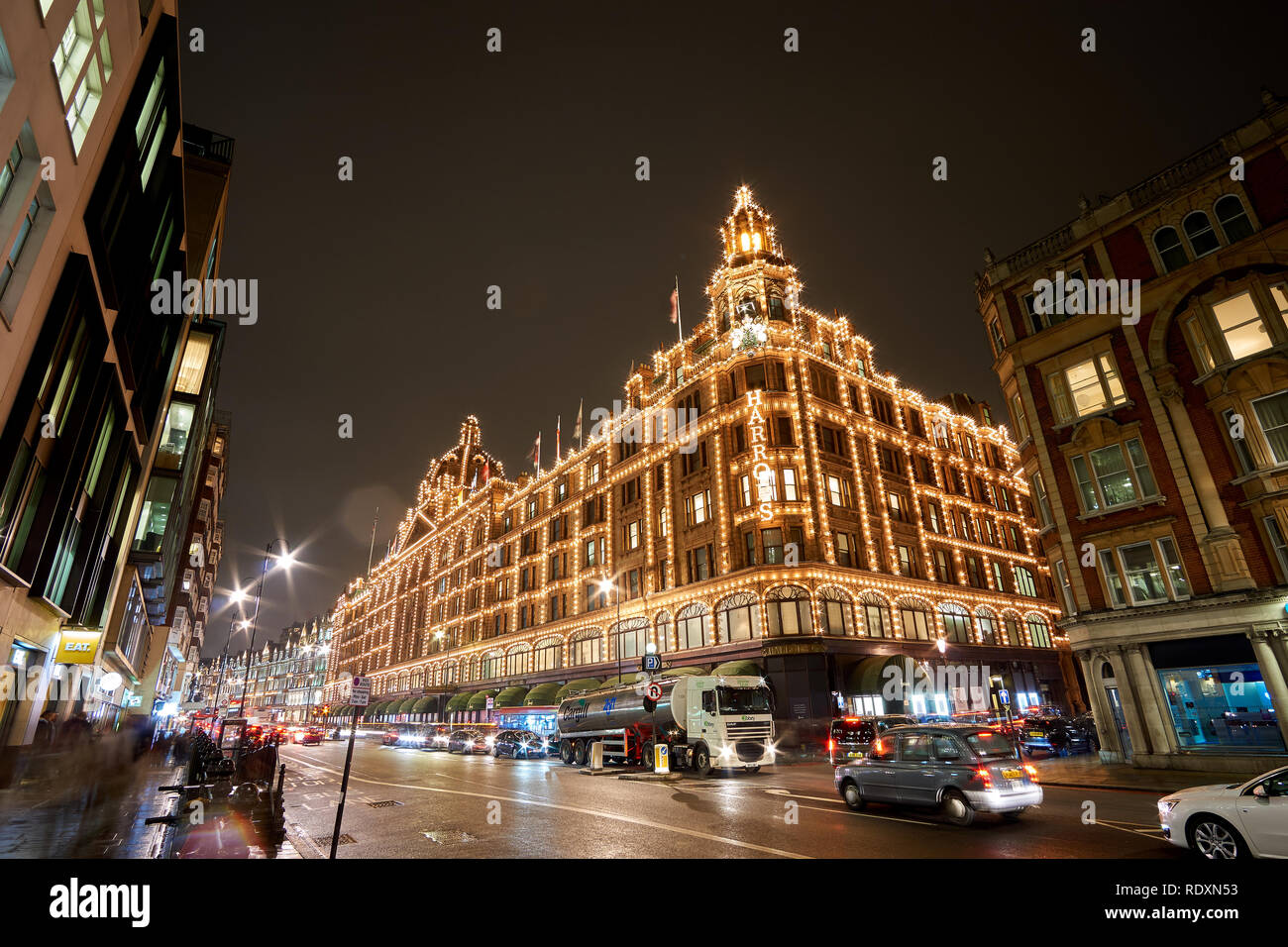 Exterior view of Harrods Department Store in London at night during ...