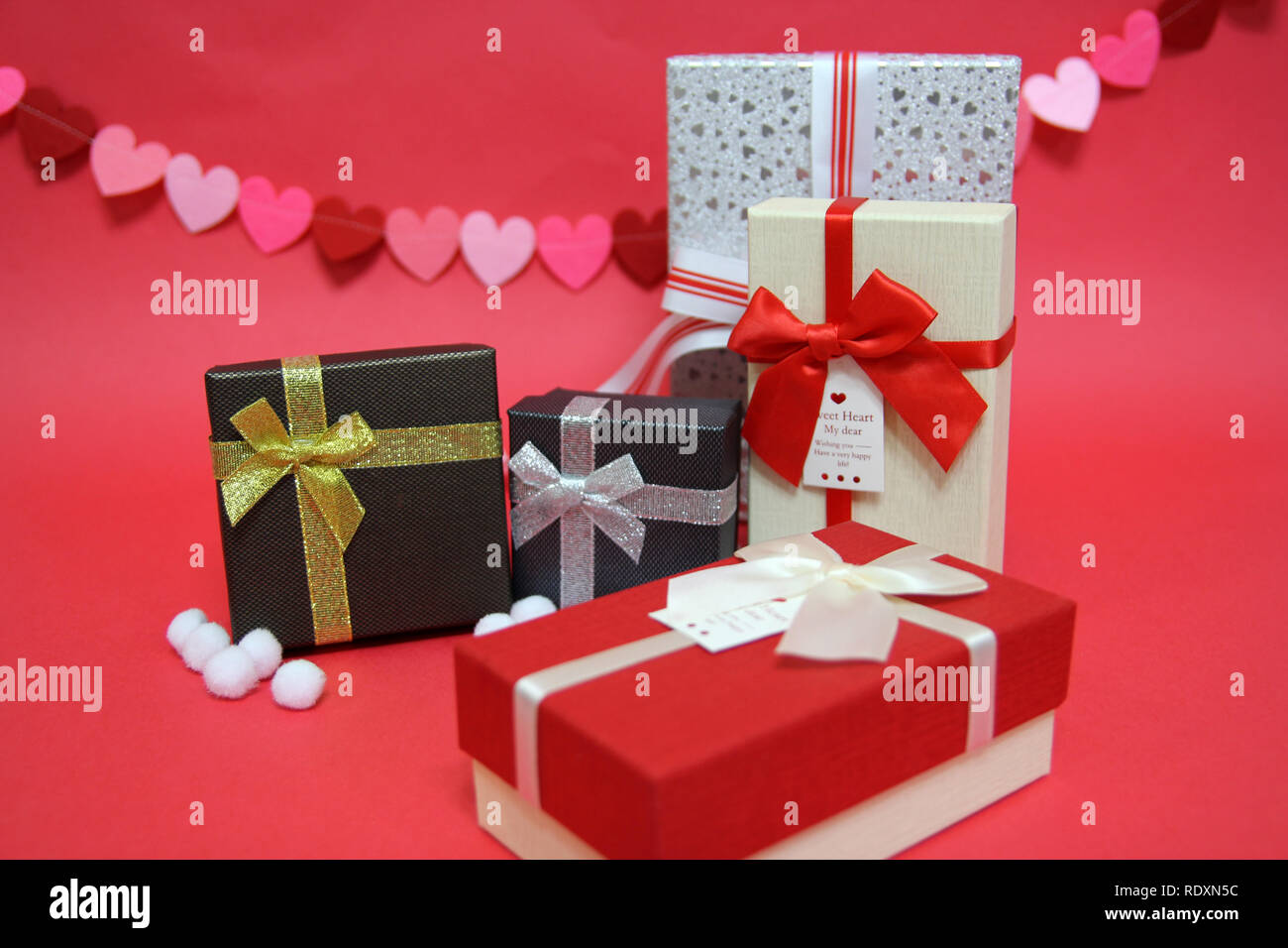 Gift box with red theme Stock Photo - Alamy