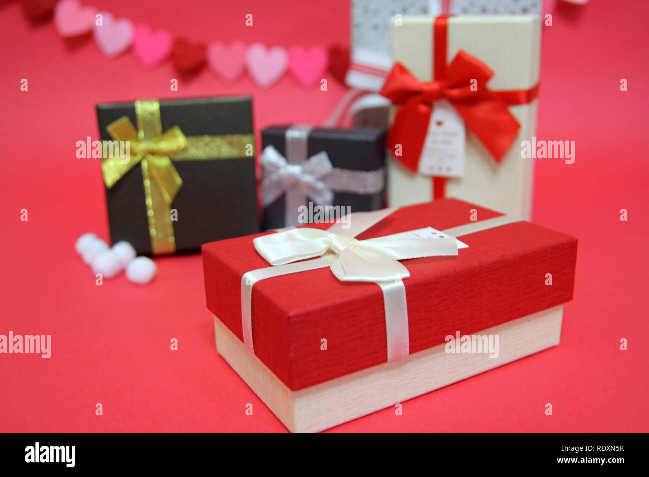 Gift box with red theme Stock Photo - Alamy