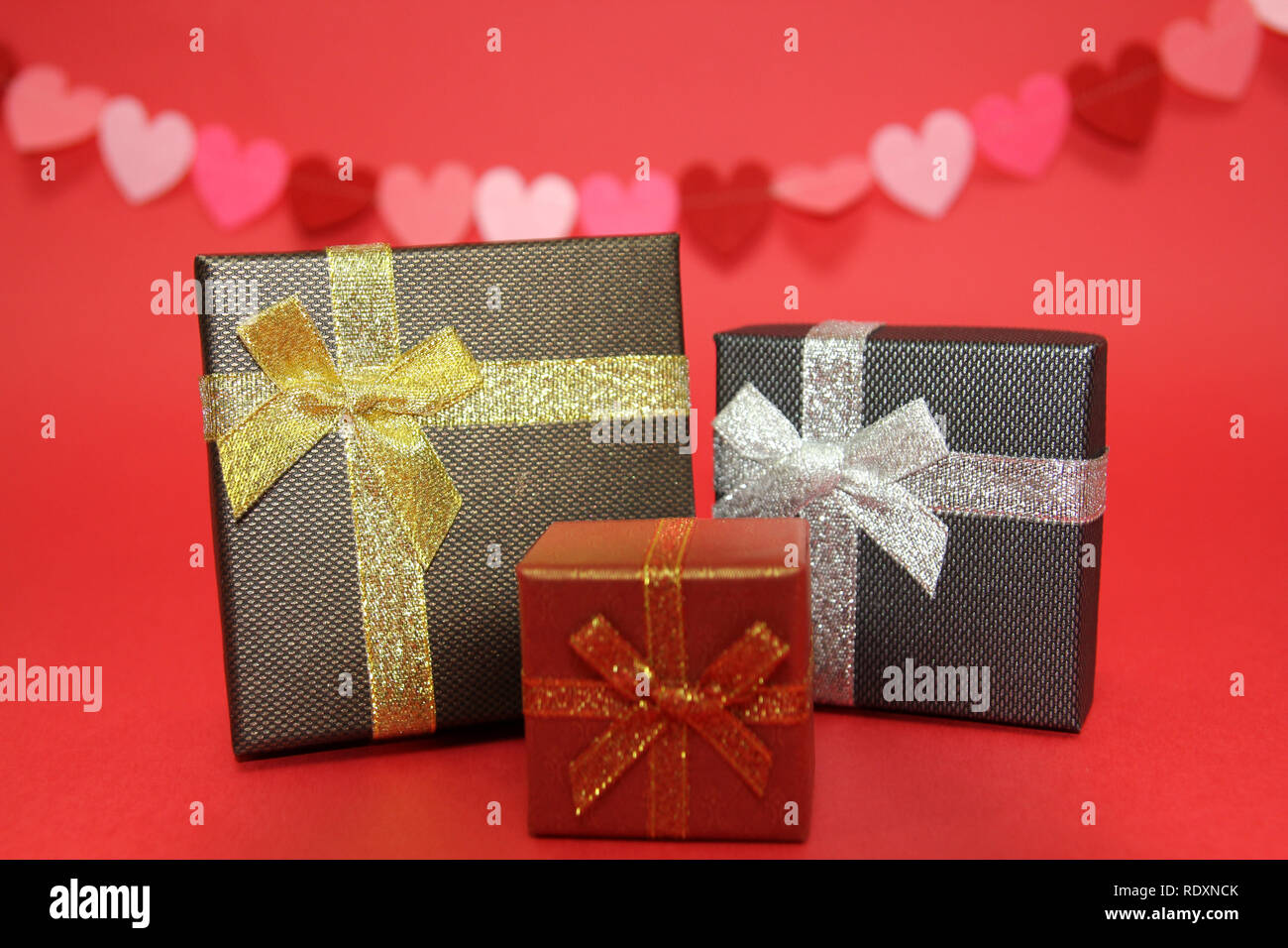 Gift box with red theme Stock Photo - Alamy