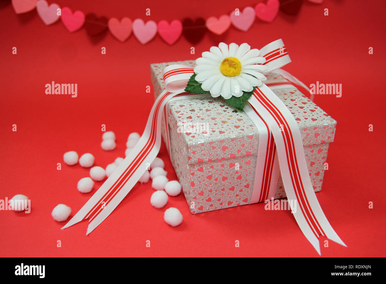Gift box with red theme Stock Photo - Alamy