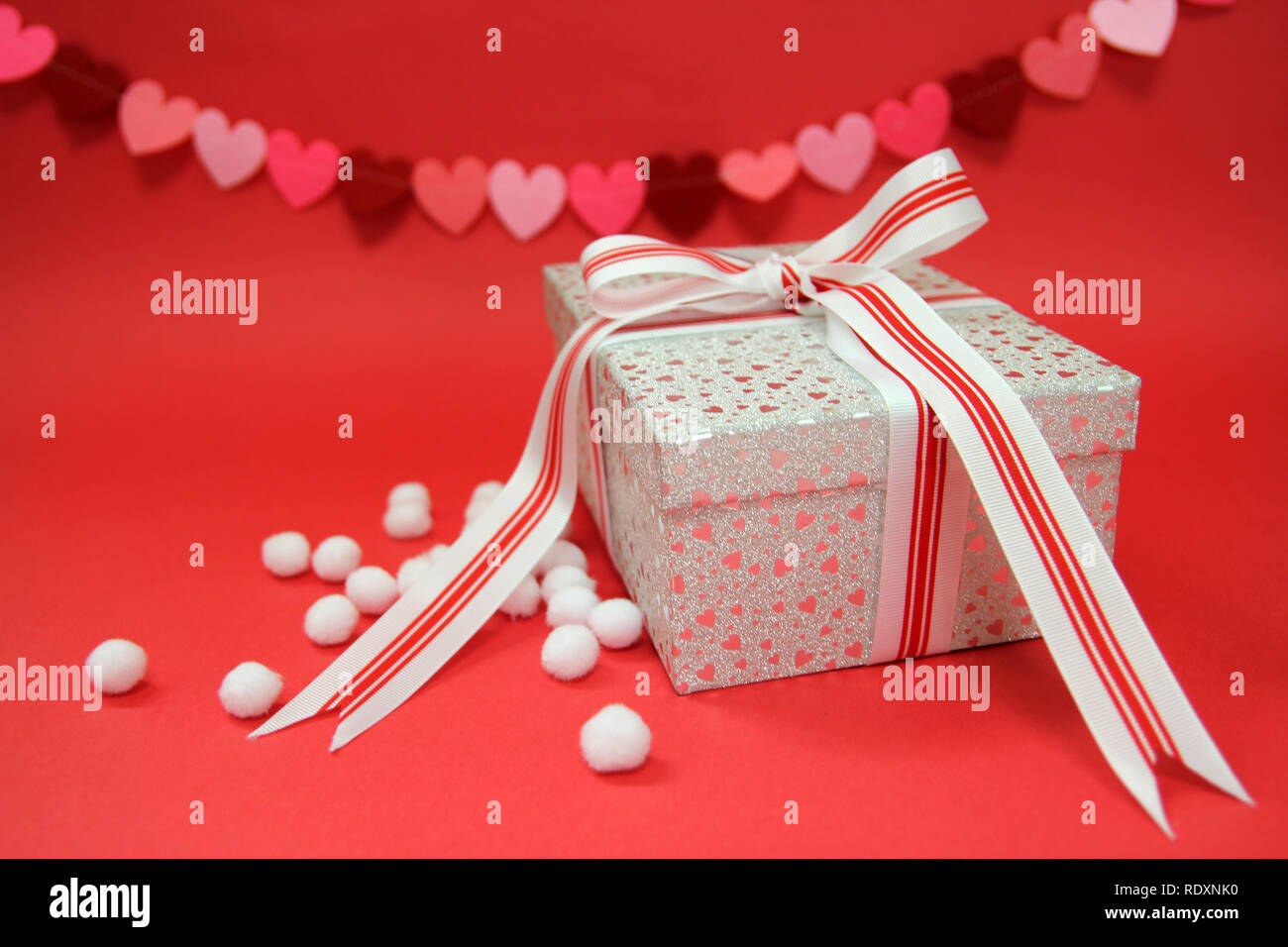 Gift box with red theme Stock Photo - Alamy