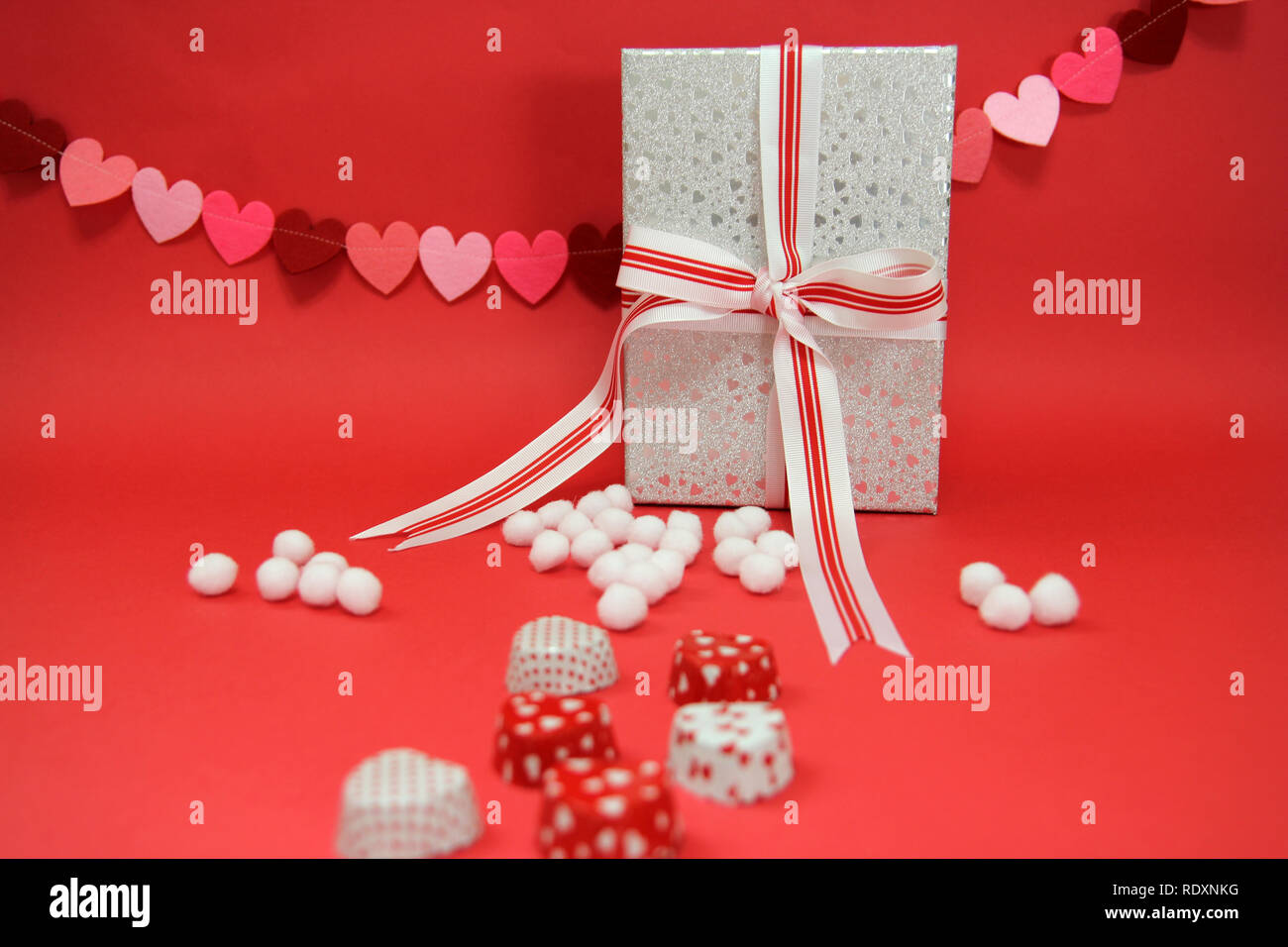 Gift box with red theme Stock Photo - Alamy