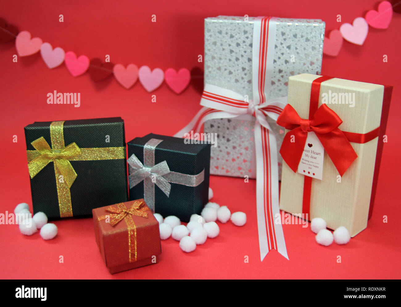 Gift box with red theme Stock Photo - Alamy