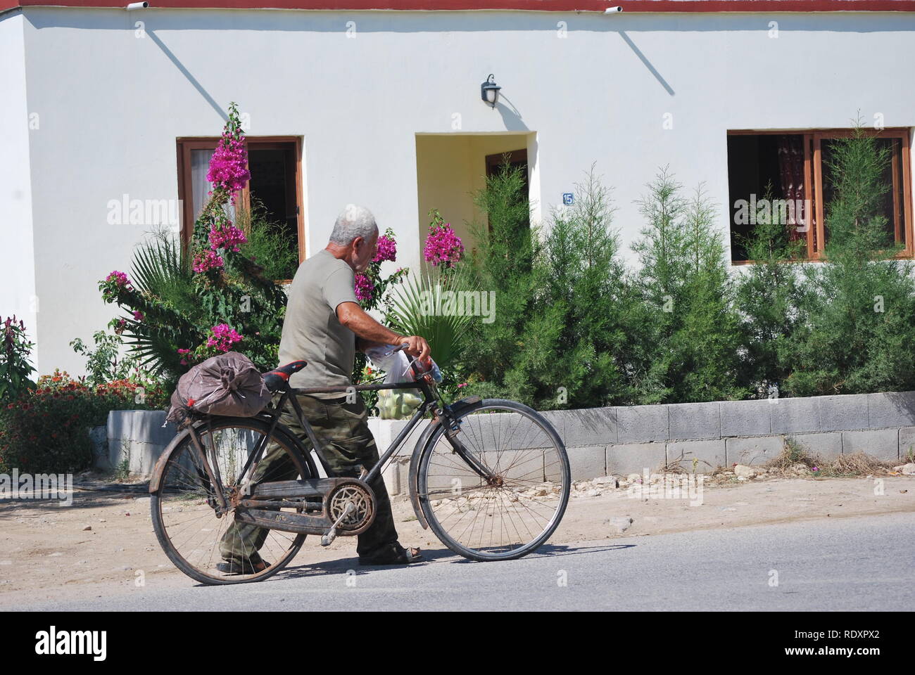 Pushing a bike hi-res stock photography and images - Alamy