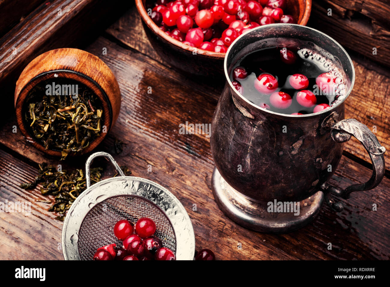 Fruit tea with wild berries in glass cup Stock Photo - Alamy