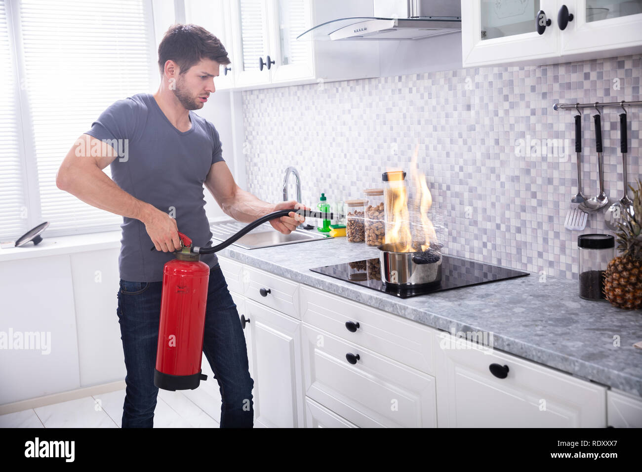 Hand man fire extinguisher hi-res stock photography and images - Alamy