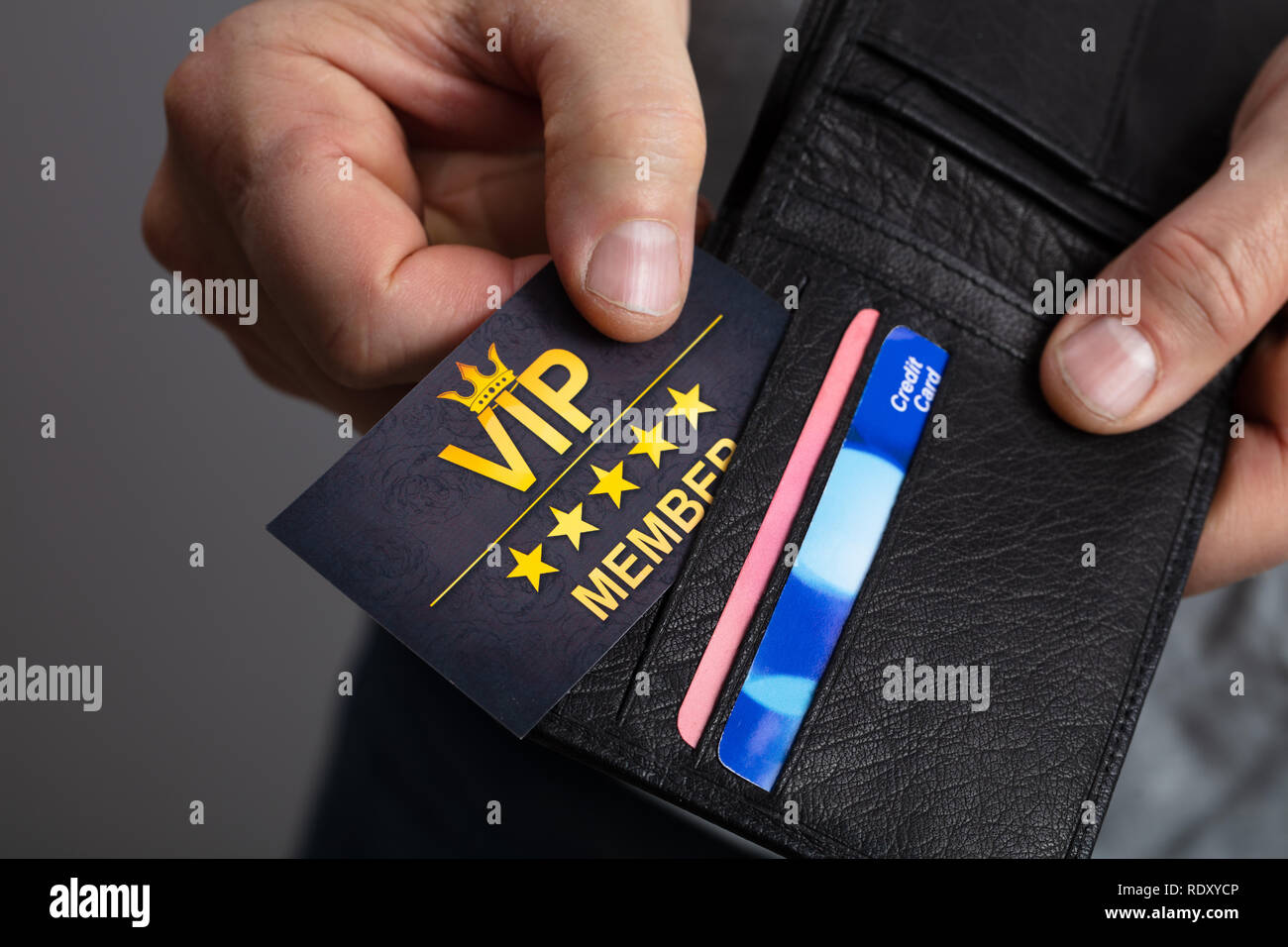 Close-up Of A Man Hand Removing Vip Member Card From Wallet Stock Photo ...