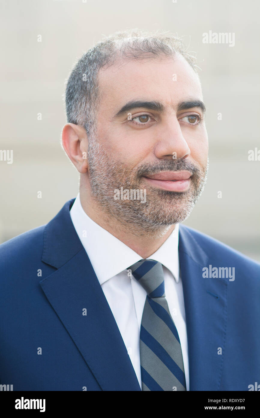 Middle eastern business man wearing a suit outdoors Stock Photo - Alamy