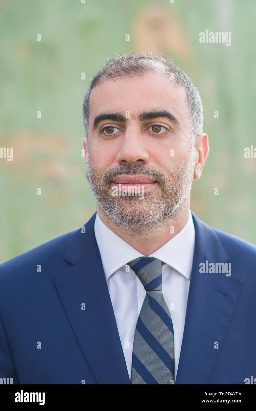 Middle eastern business man wearing a suit outdoors Stock Photo - Alamy
