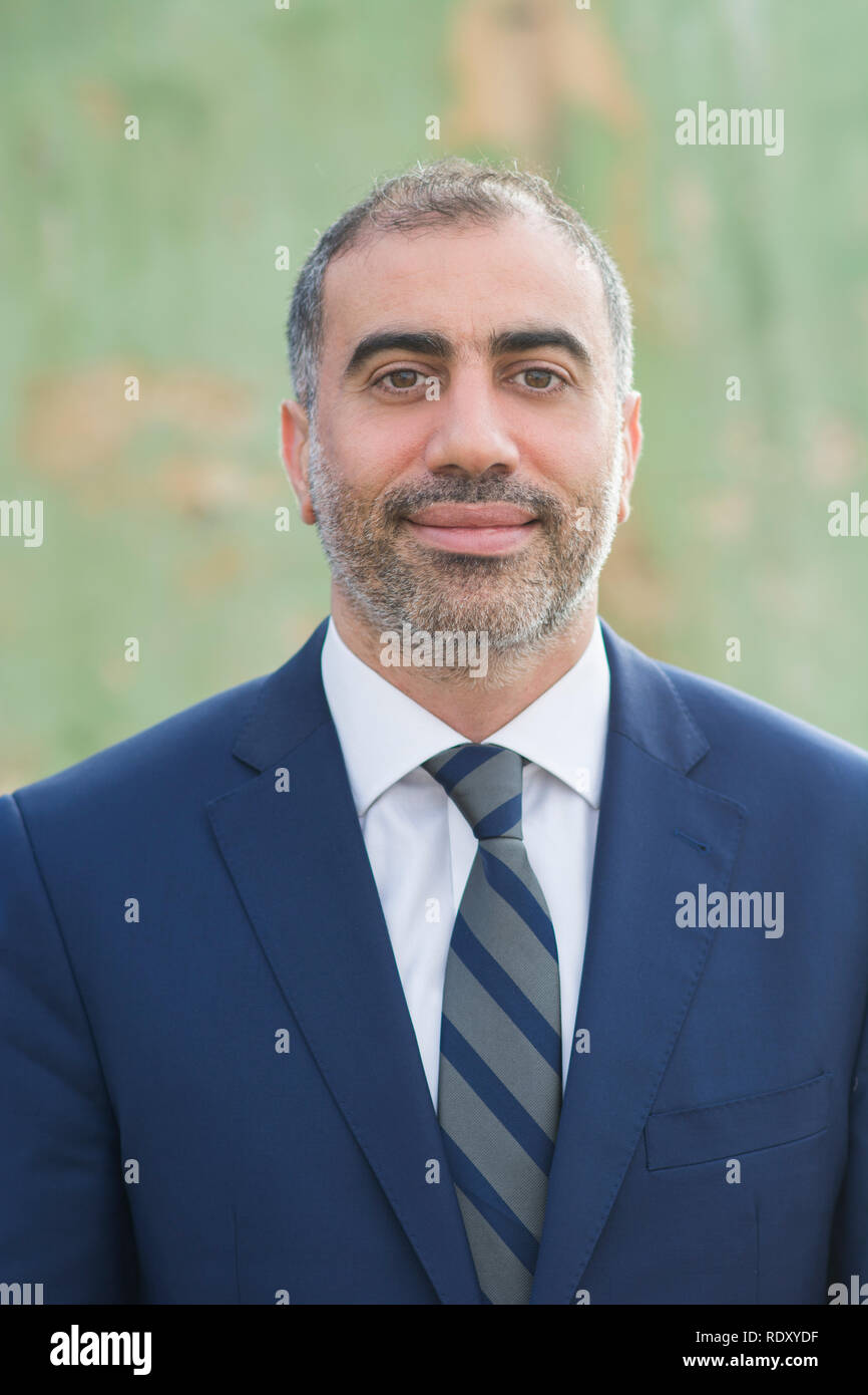 Middle eastern business man wearing a suit outdoors Stock Photo - Alamy