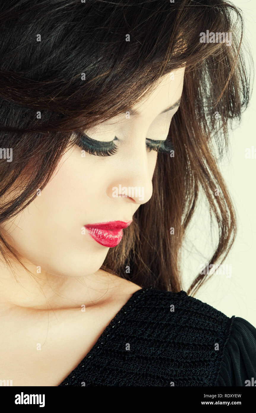 Beautiful woman looking down Stock Photo - Alamy