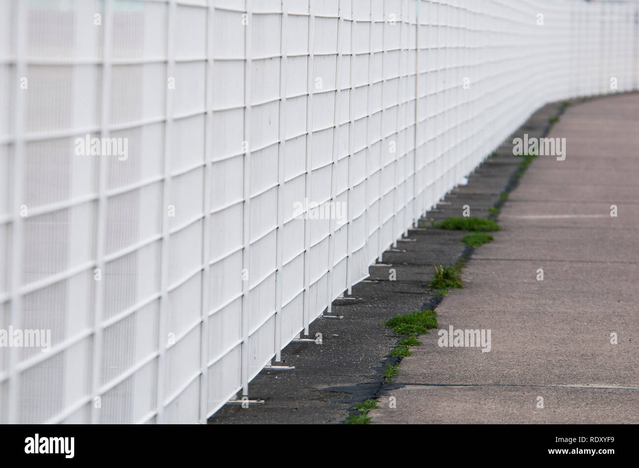 White metal fence Stock Photo - Alamy