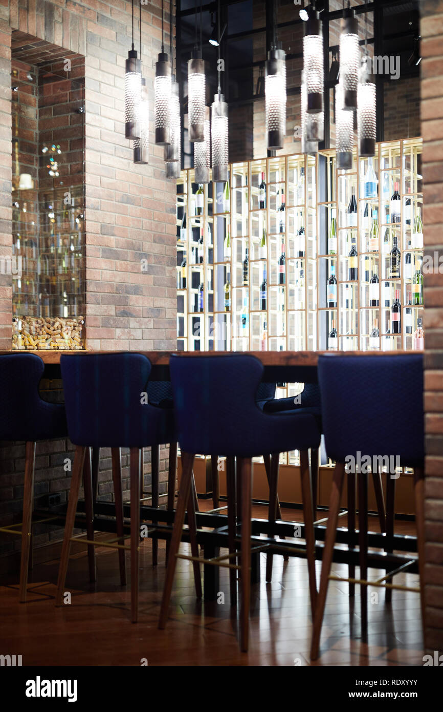 Armchairs along table Stock Photo - Alamy