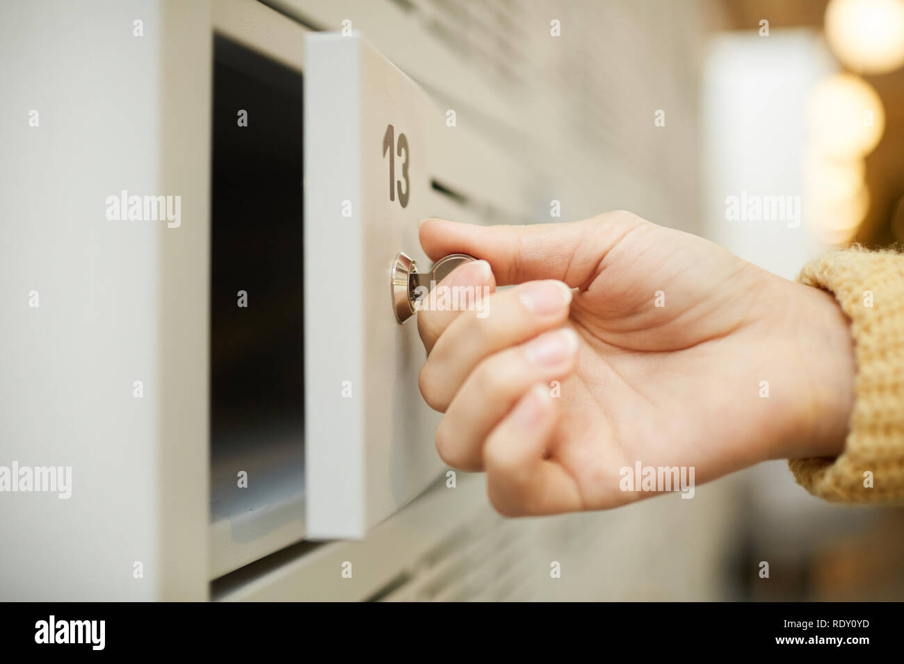 Woman locking door hi-res stock photography and images - Alamy