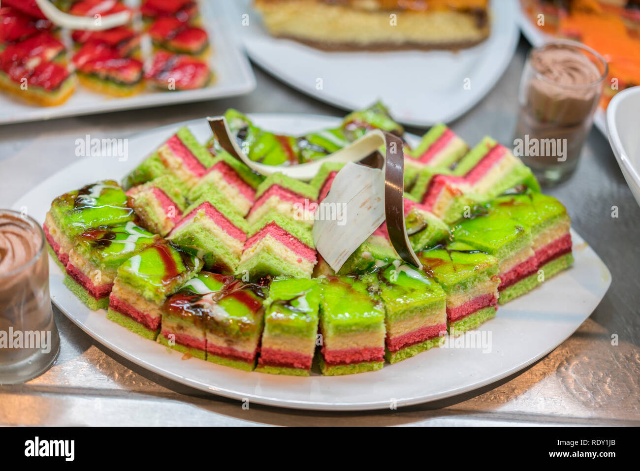 Various desserts in the restaurant. Composition of pastry desserts of ...