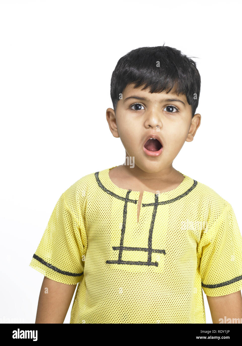 PORTRAIT OF A YOUNG BOY SHOT AGAINST A WHITE BACKGROUND Stock Photo - Alamy