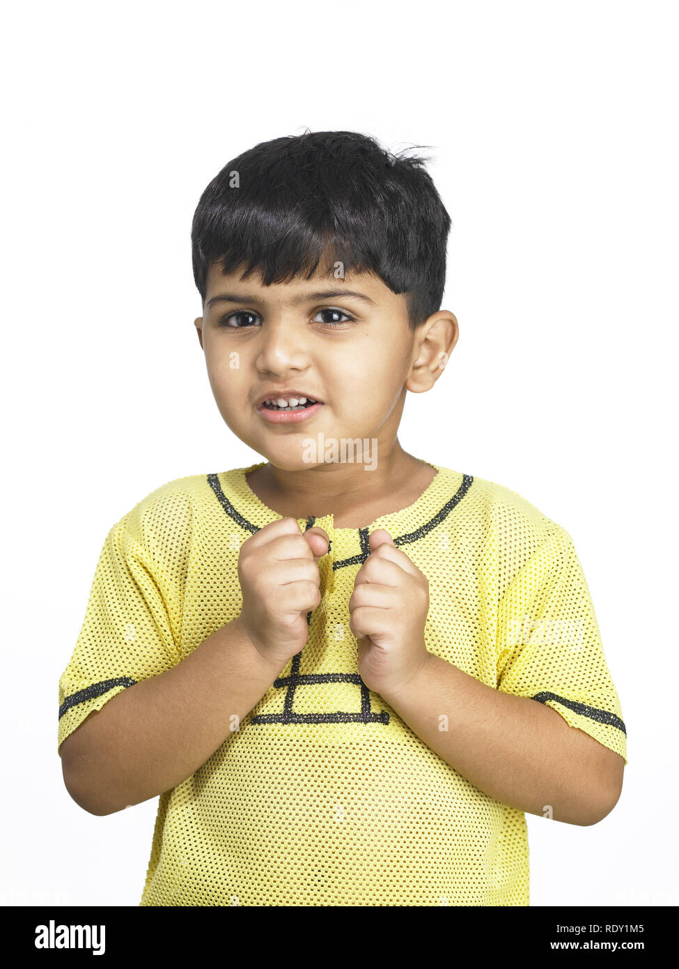 PORTRAIT OF A YOUNG BOY SHOT AGAINST A WHITE BACKGROUND Stock Photo - Alamy