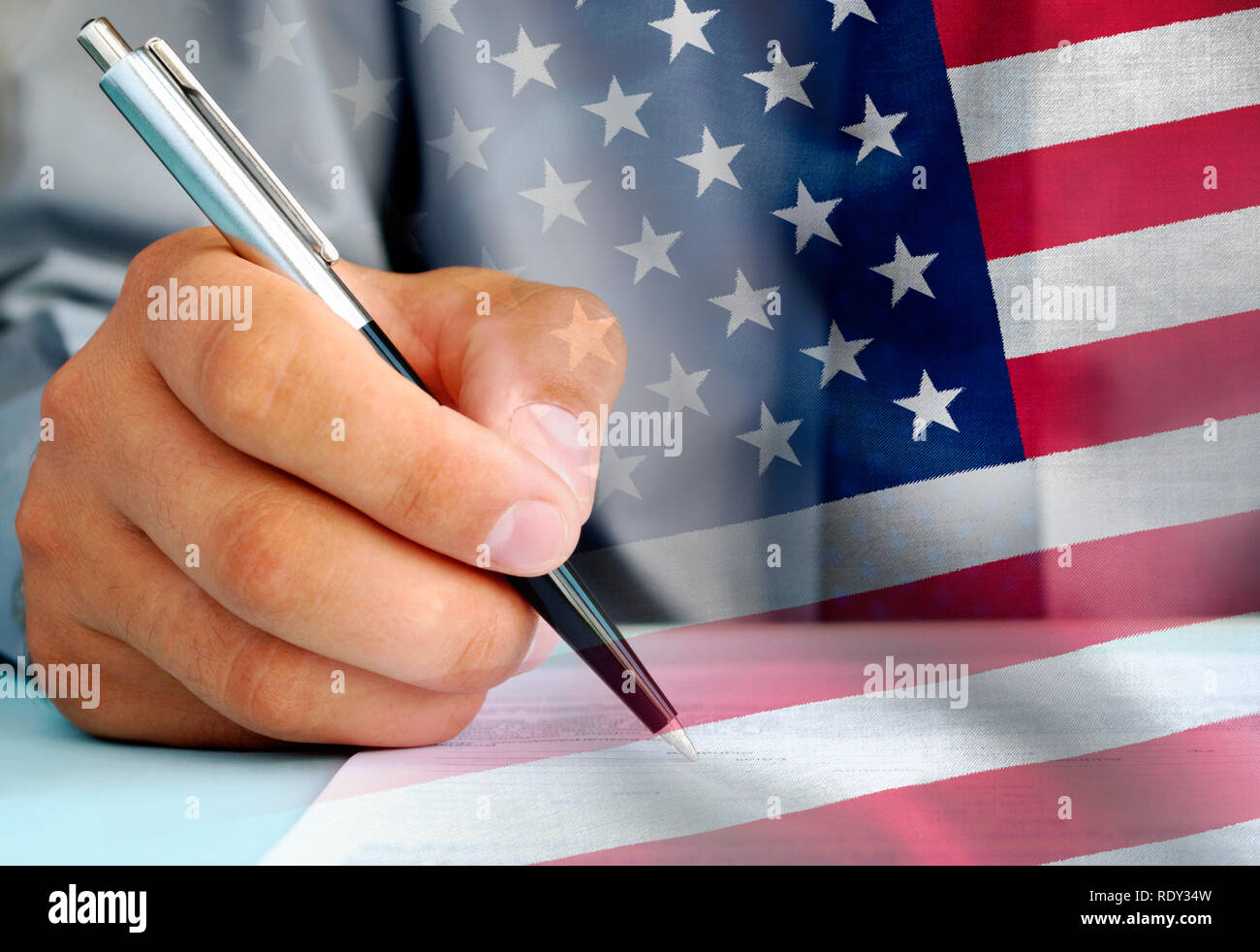 United States official signing an official document with a ballpoint ...
