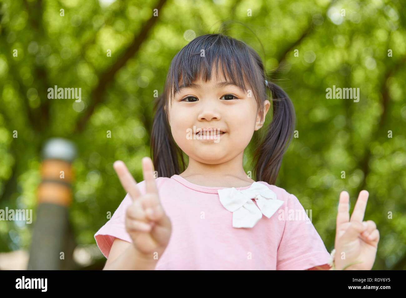 Japanese kid in a city park Stock Photo - Alamy