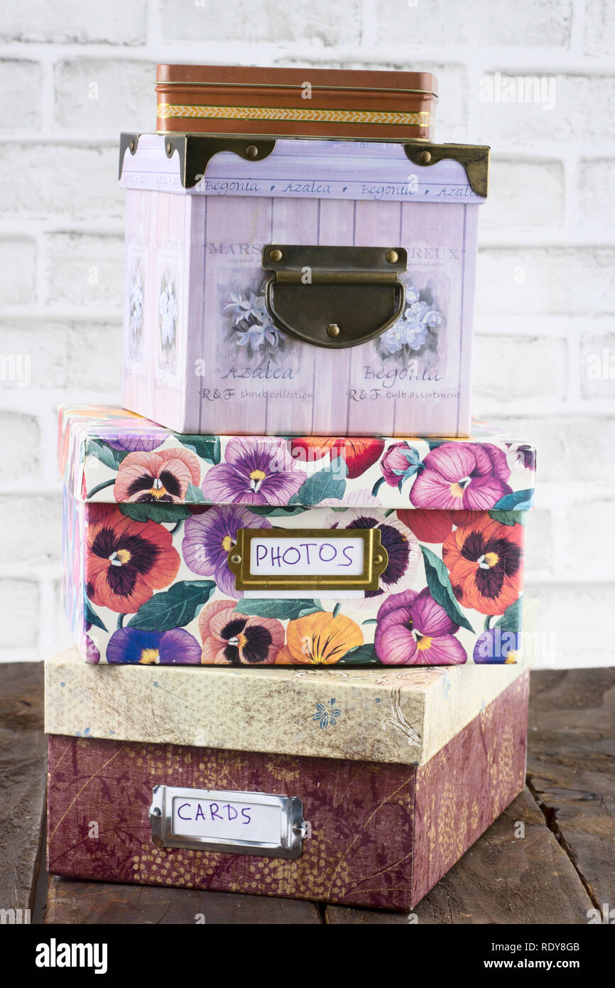 A stack of different size boxes for organizing small items at home ...