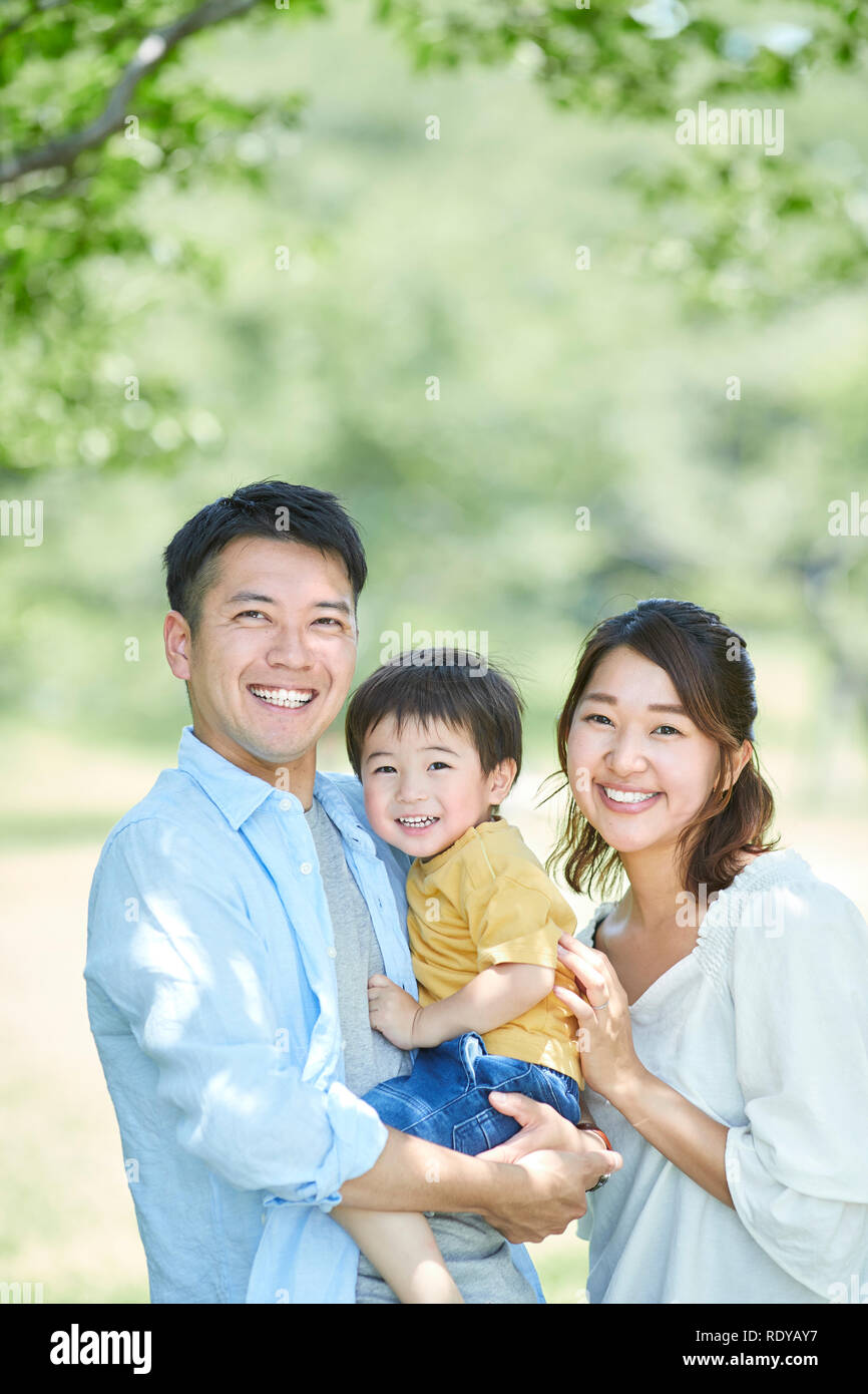 Japanese family in a city park Stock Photo - Alamy