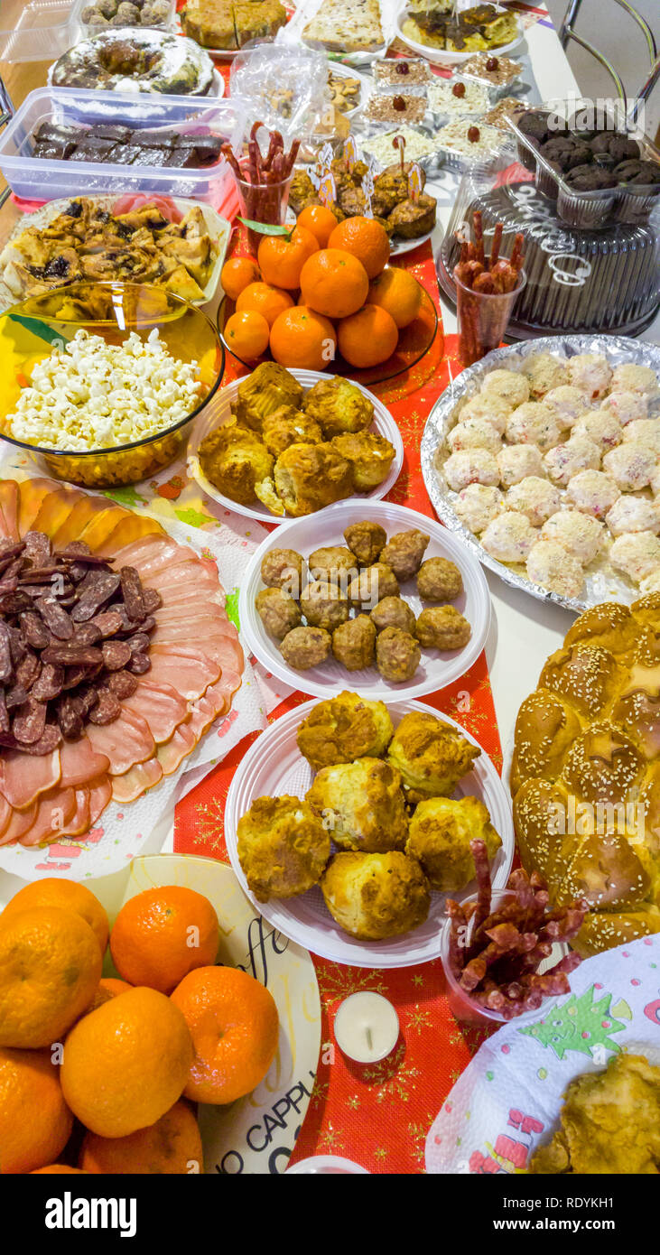 Rich table spread with many different dishes, fruits and deserts Stock ...