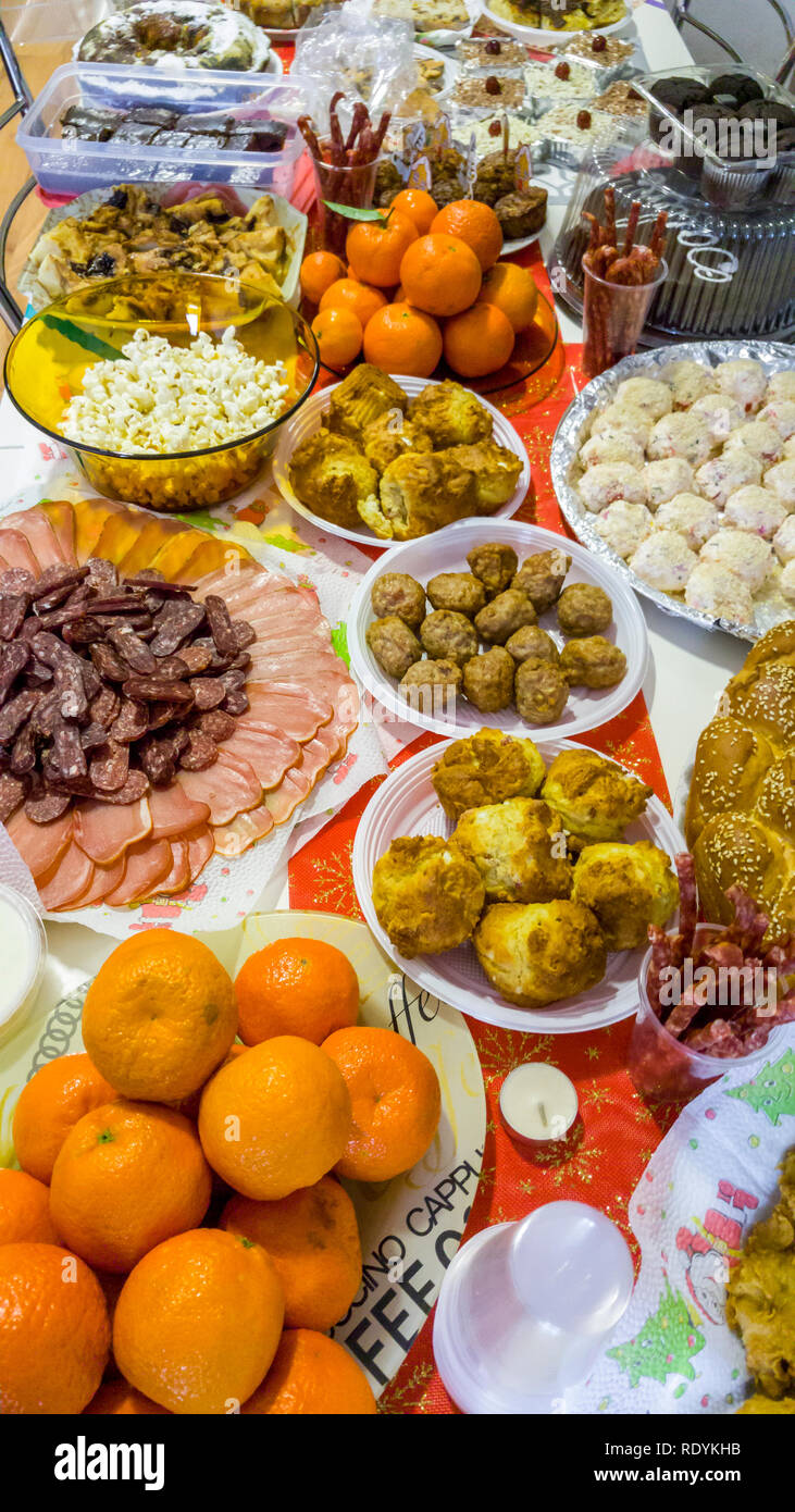 Rich table spread with many different dishes, fruits and deserts Stock ...