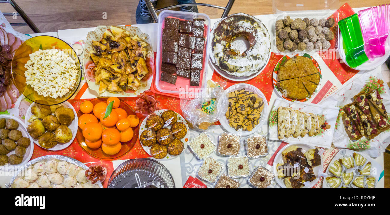 Top view of rich table spread with many different dishes, fruits and ...