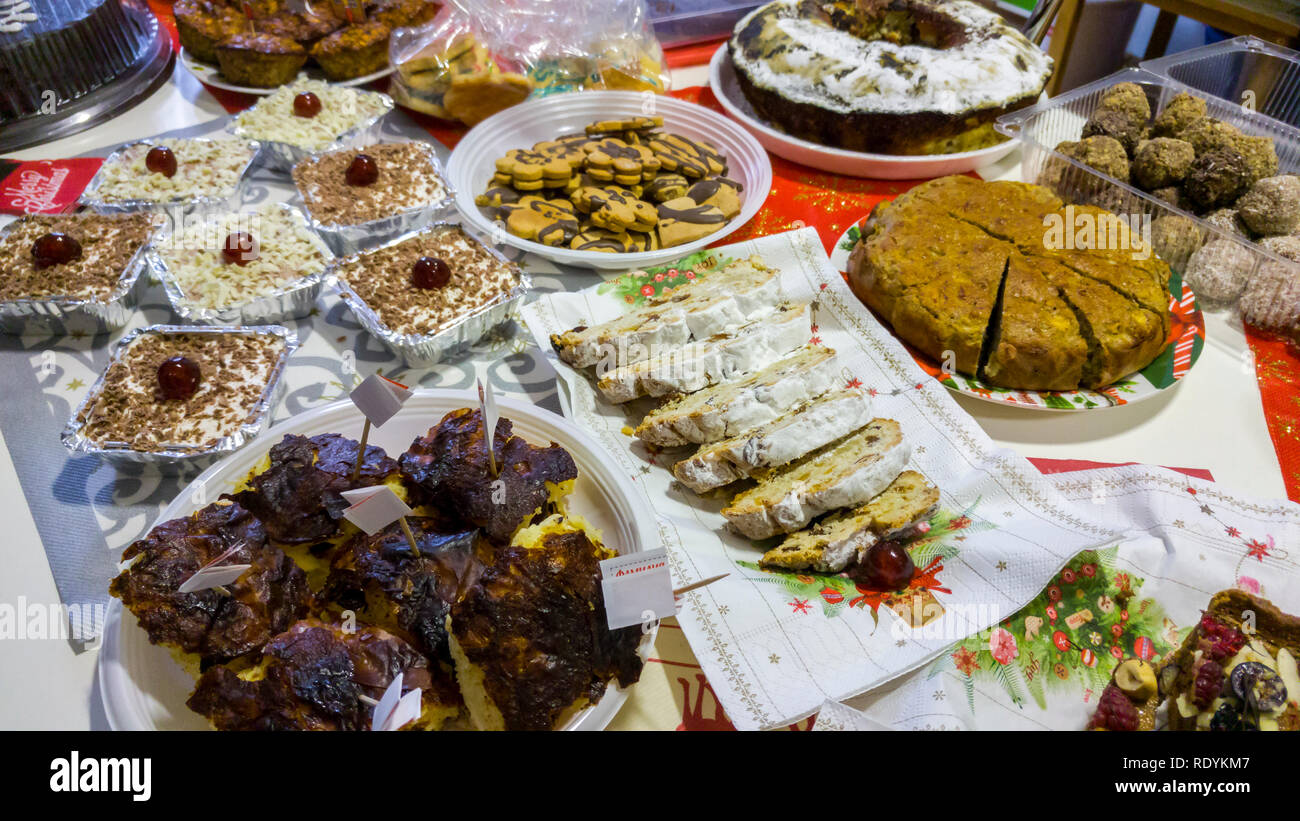 Rich table spread with many different dishes, fruits and deserts Stock ...
