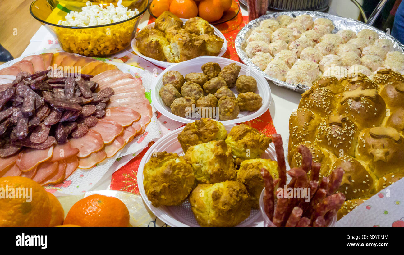 Rich table spread with many different dishes, fruits and deserts Stock ...