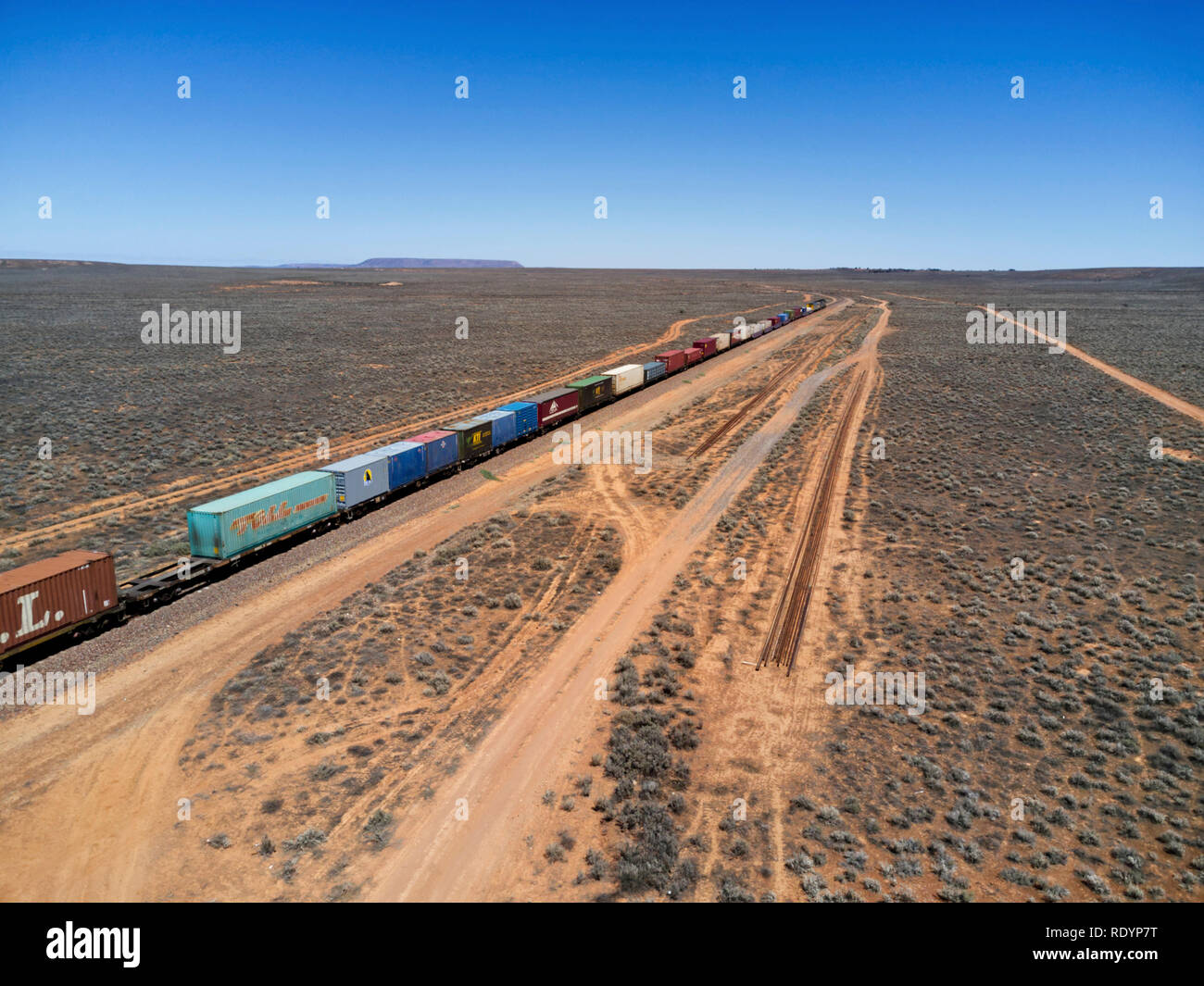 Aerial of freight train heading for Darwin just outside of Port Augusta ...