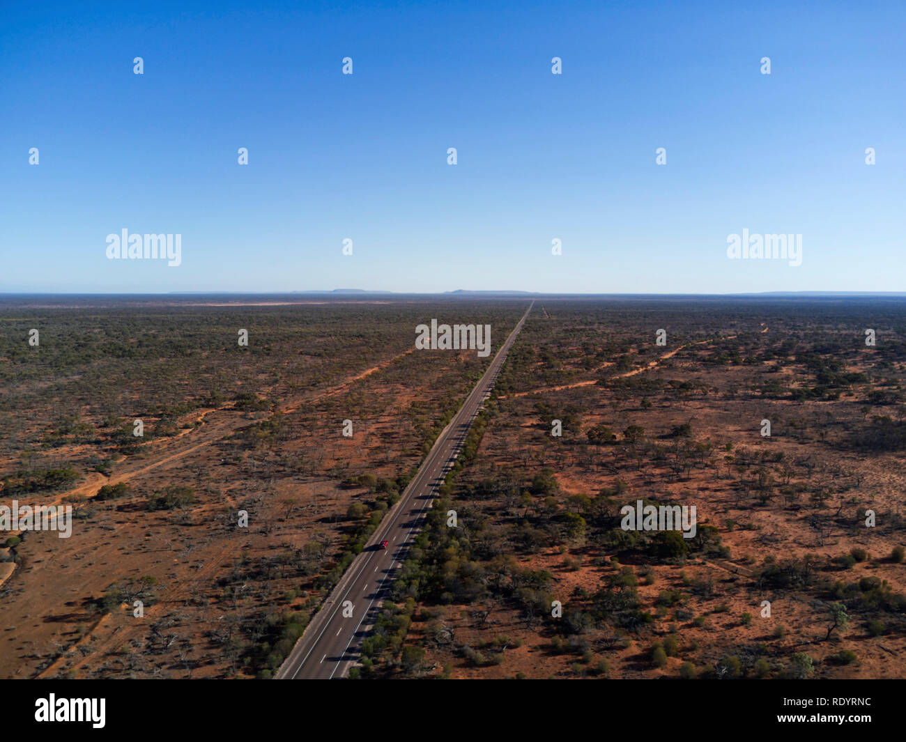 Aerial of the Stuart Highway as it crosses the flat arid landscape of ...