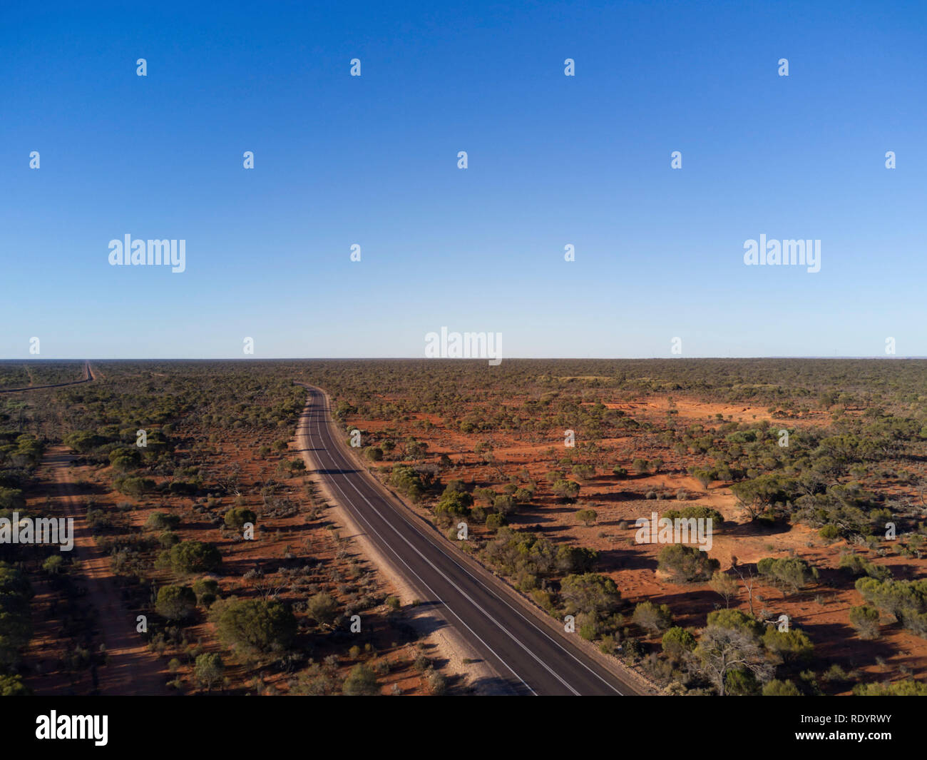 Aerial of the Stuart Highway as it crosses the flat arid landscape of ...